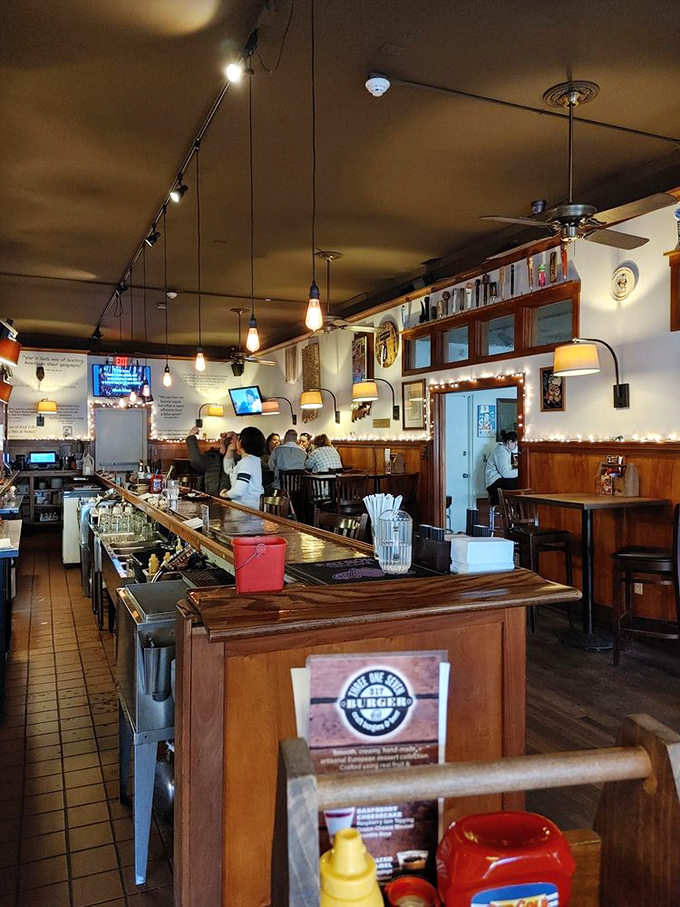 The warm wooden bar invites you to pull up a stool and stay awhile. Notice nobody's looking at their phones&mdash;the food has their full attention.