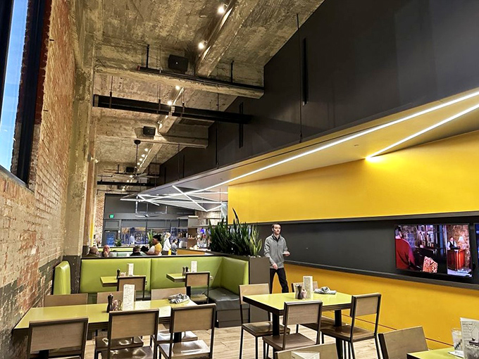 The lime-green and yellow interior pops against exposed brick, creating a space that's as cheerful as the food is delicious.