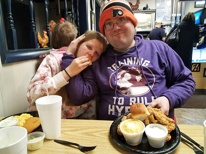 The universal expression of fried chicken bliss&mdash;where family memories are made one crispy bite at a time.