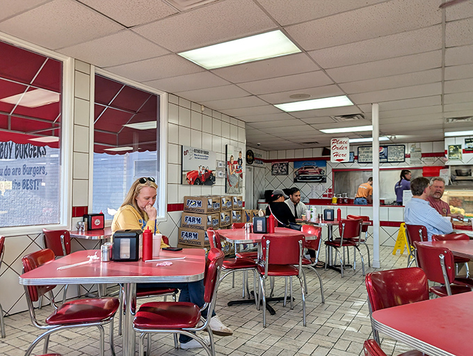 The diner aesthetic isn't retro here; it's timeless. These tables have witnessed countless first bites followed by that knowing nod of burger approval.