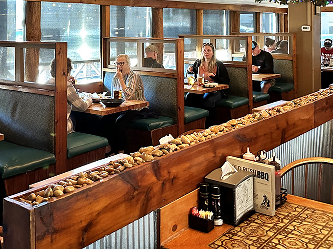Booths designed for serious eating business. That river rock divider? Straight from a prospector's dream of the perfect dining spot.