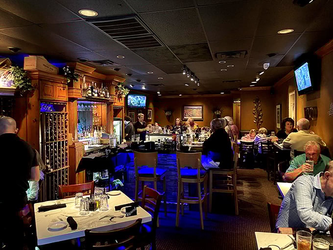 The dining room hums with the universal language of good food. Notice how nobody's looking at their phones? That's the pasta effect.