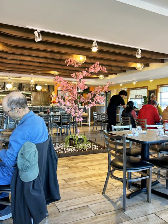 The cherry blossom centerpiece adds a touch of serenity to a dining room where serious waffle business takes place daily.