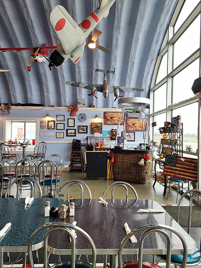 Model planes suspended from the curved ceiling create the feeling of dining inside an actual hangar&mdash;without the jet fuel aroma.