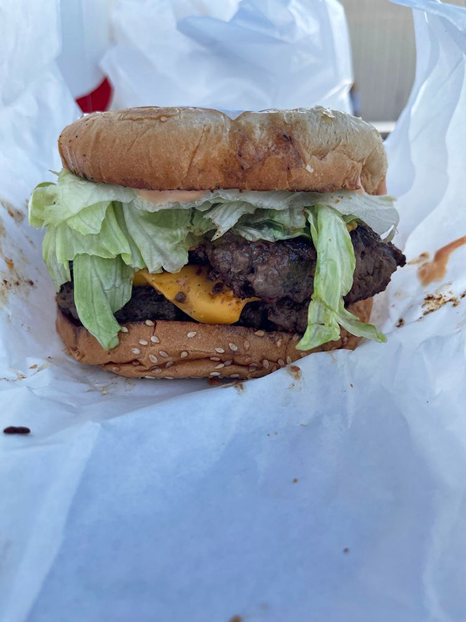 A burger that demands a two-handed commitment. This isn't fast food &ndash; it's slow food served fast, with melty cheese and fresh lettuce adding perfect contrast.