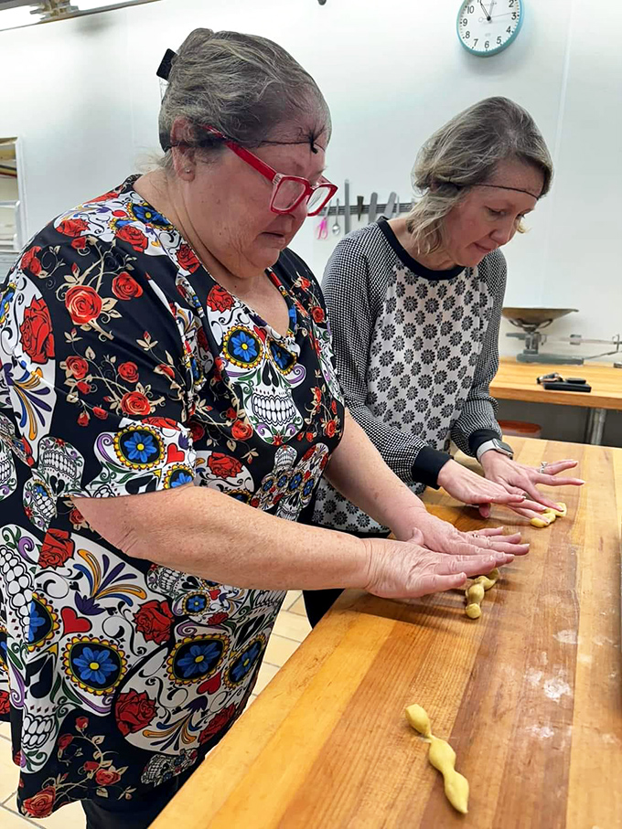 Hands that know dough like old friends, creating magic through muscle memory and generations of passed-down precision. 