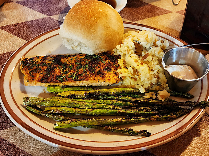 This isn't just grilled fish&mdash;it's an inland seafood revelation. Those charred asparagus spears aren't just sides; they're green exclamation points on a perfect plate.