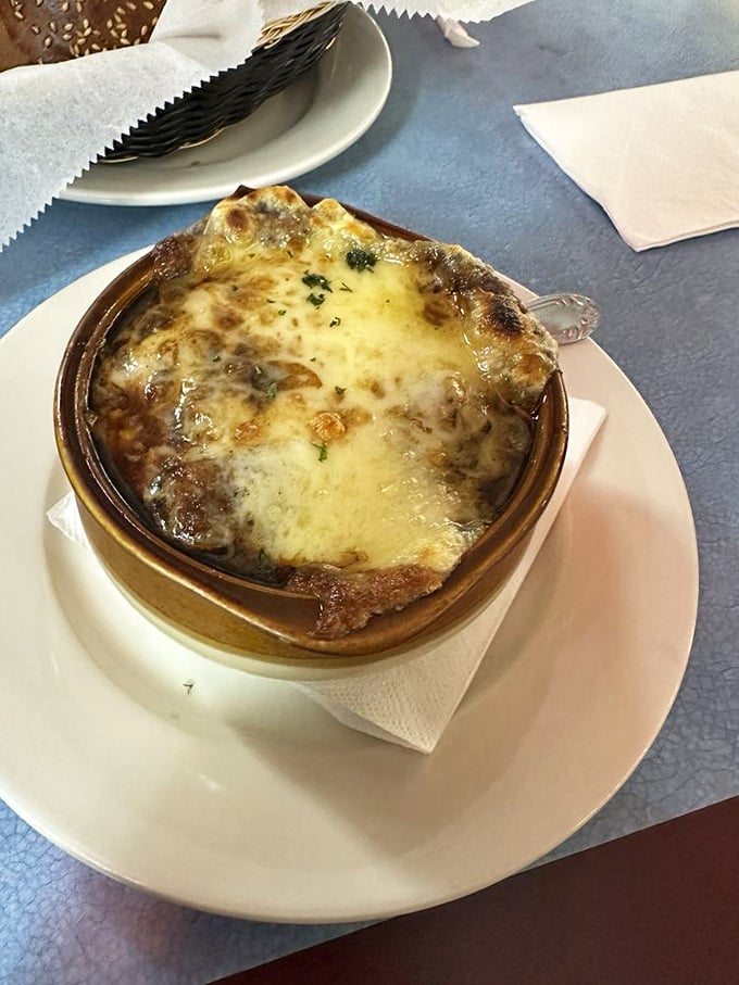 French onion soup with a cheese cap so perfect it could make a Parisian weep. Spoon-breaking satisfaction guaranteed.