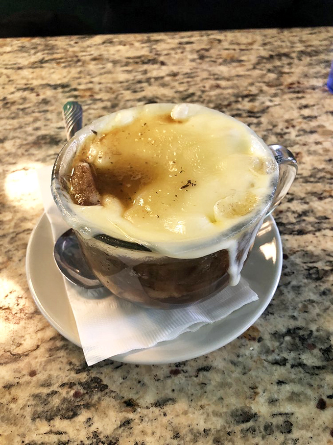 French onion soup with a cheese cap so magnificent it deserves its own superhero cape and origin story.