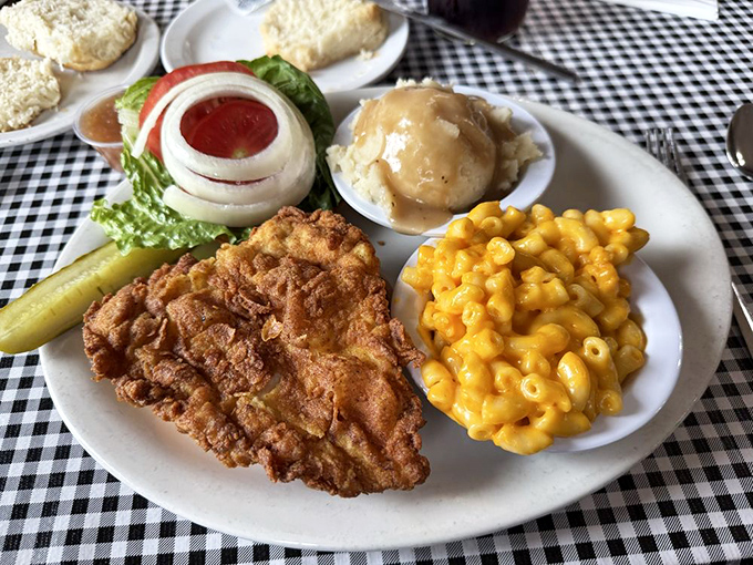 Fried chicken so perfectly golden, with mac and cheese so vibrant, it's like sunshine decided to become comfort food.