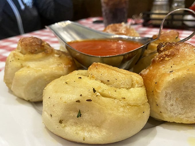 Garlic knots so plump they look like they've been working out, with a side of marinara for their victory lap.