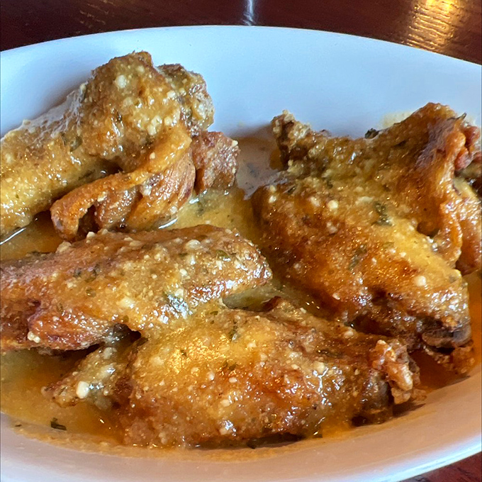 Garlic parmesan wings that make you forget table manners exist. Worth the sticky fingers and inevitable shirt stains.