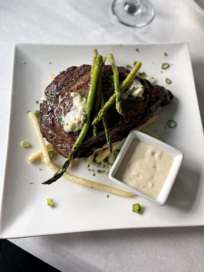 A steak that makes you understand why humans discovered fire in the first place. That herb butter melting seductively says it all.
