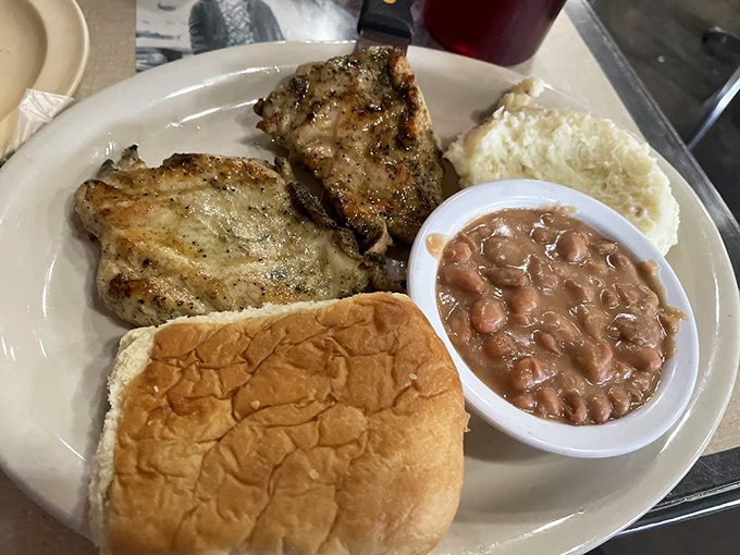 Simple yet sublime—grilled chicken with just the right char marks, a fluffy roll, and beans that have clearly been simmering to perfection.