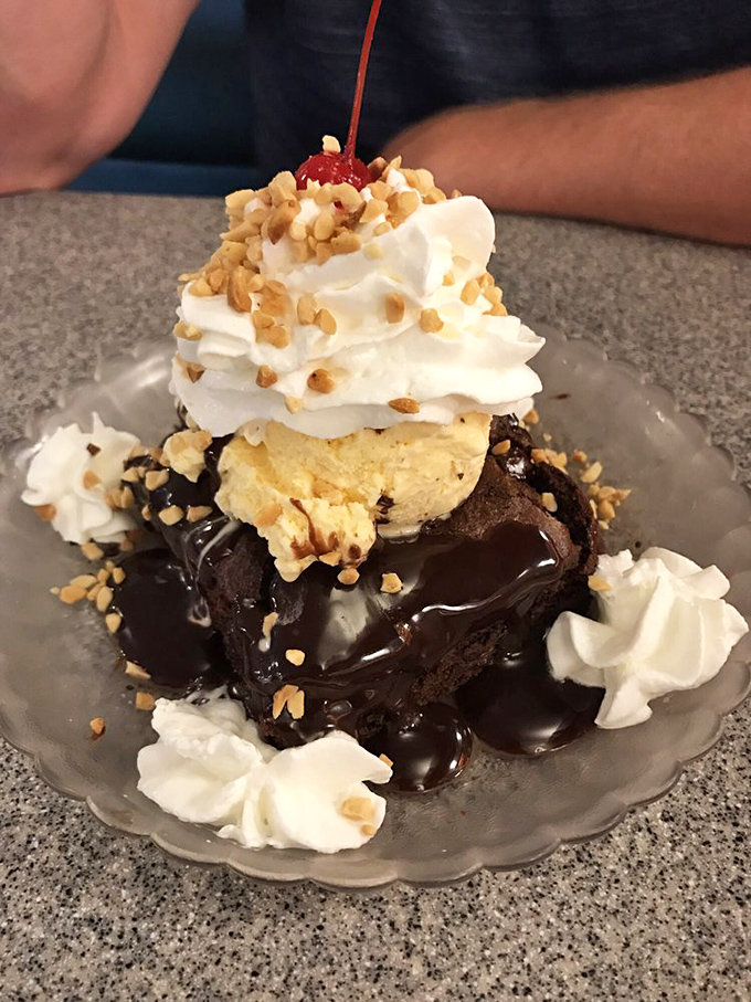 This brownie sundae isn't dessert&mdash;it's a chocolate skyscraper with ice cream penthouse and whipped cream clouds that touch heaven.