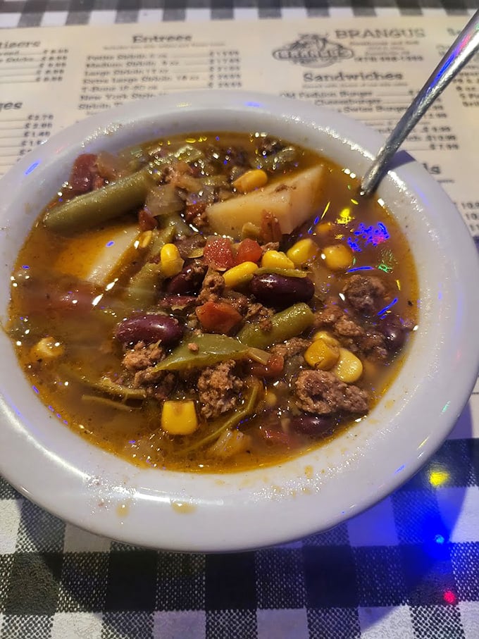 The chicken salad arrives like a protein-packed landscape, with croutons standing guard and ranch dressing pools waiting for your dipping pleasure.