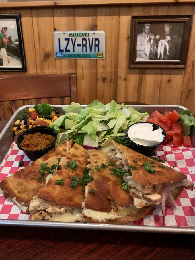 This sandwich isn't messing around – crispy exterior giving way to perfectly cooked fish, all served with the fresh accoutrements a proper meal deserves.