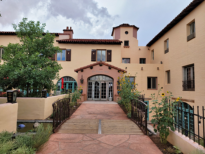 La Posada's entrance beckons with desert gardens and Spanish Colonial charm. Walking this path feels like stepping into Arizona's golden age.