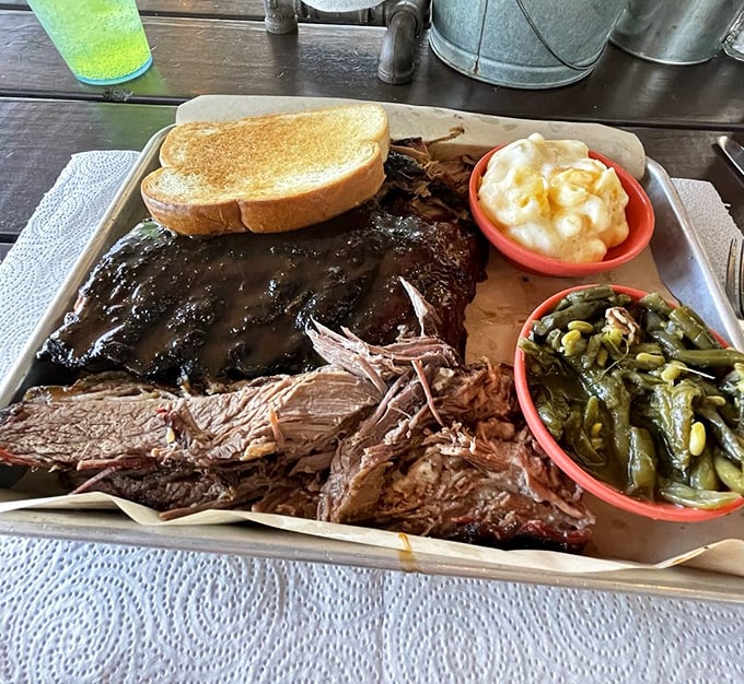 This isn't just a meat platter&mdash;it's edible art. The pulled pork and ribs have clearly been on a long, smoky journey to reach your plate.