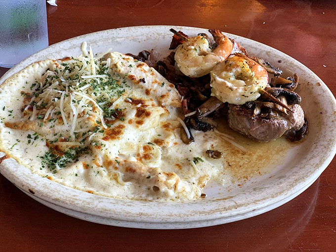 Surf and turf, Marchello's style&mdash;tender medallions sharing the plate with perfectly cooked shrimp and a side of what looks like heavenly pasta.