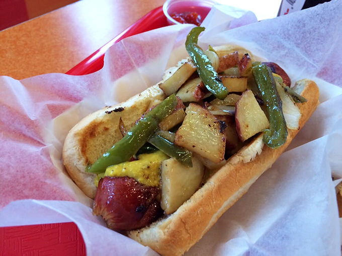 This isn't just a hot dog&mdash;it's architectural genius. Those roasted peppers and potatoes create a masterpiece that demands to be photographed before devouring.