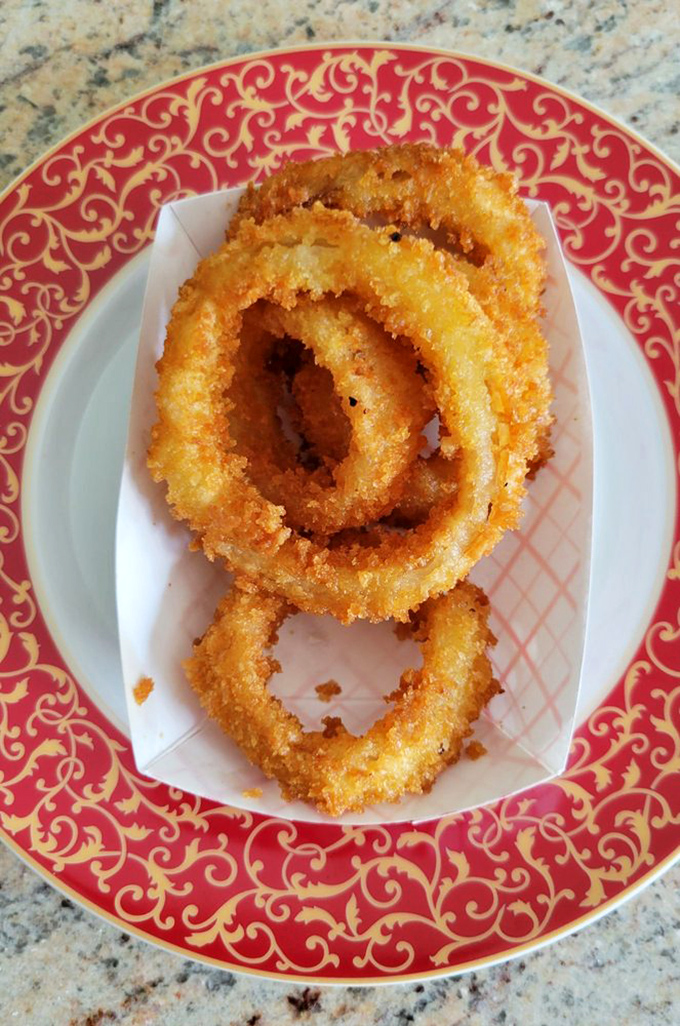 These golden onion rings aren't just a side dish&mdash;they're crispy halos of happiness that deserve their own moment in the spotlight.