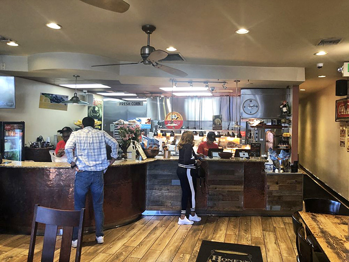 The counter where dreams come true, staffed by people who understand the gravity of proper fried chicken.