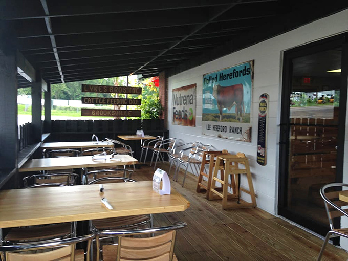 The covered porch dining area offers a respite from the Florida sun while vintage ranch signs remind you of the state's cattle country roots.