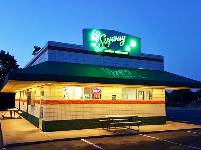As dusk settles, the Skyway's neon glow transforms an ordinary parking lot into a beacon of comfort food possibilities.