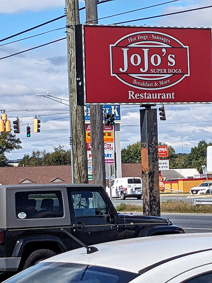 The Jo Jo's sign stands as a beacon of hope for the hungry traveler. Like a lighthouse, but instead of rocks, it saves you from mediocre meals.