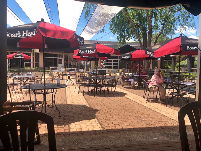 Outdoor seating for those who prefer their deli delights with a side of vitamin D. Urban oasis meets sandwich paradise.