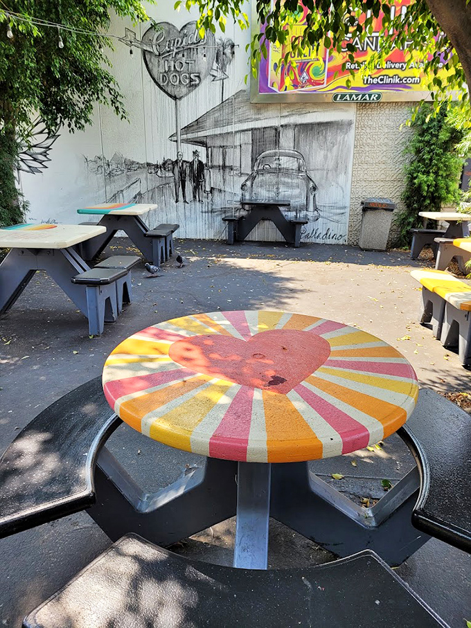 The colorful heart-shaped table centerpiece says it all. At Cupid's, even the furniture celebrates their love affair with hot dogs.
