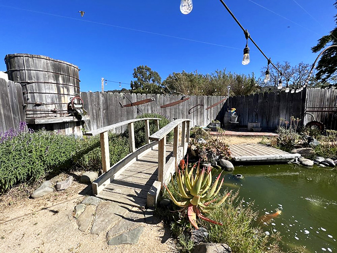 A charming garden pond complete with wooden footbridge creates an unexpected oasis&mdash;the perfect spot for contemplating the meaning of life after a transcendent meal.