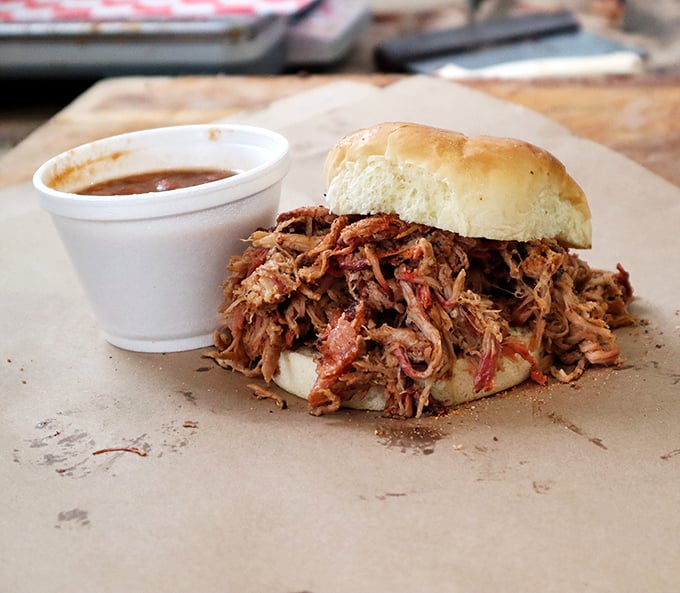 A pulled pork sandwich that makes a compelling argument for why the humble bun deserves recognition as humanity's greatest invention.