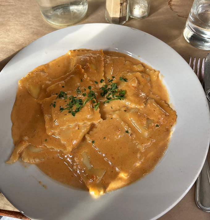 Ravioli Formaggio swimming in pink sauce&mdash;proof that sometimes the most comforting dishes are also the most memorable.