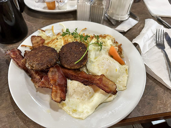 Breakfast doesn't get more honest than this&mdash;eggs, bacon, and sausage patties presented without pretension but with plenty of flavor.