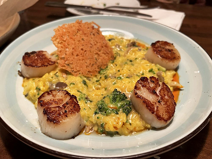 Perfectly seared scallops surrounding risotto like planets orbiting a creamy, cheesy sun&mdash;a solar system you'll want to devour. 