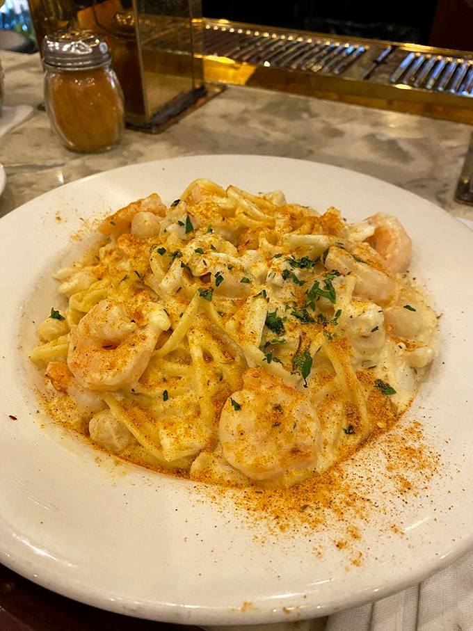 This seafood alfredo doesn't just have shrimp&mdash;it's practically a underwater neighborhood block party on pasta.