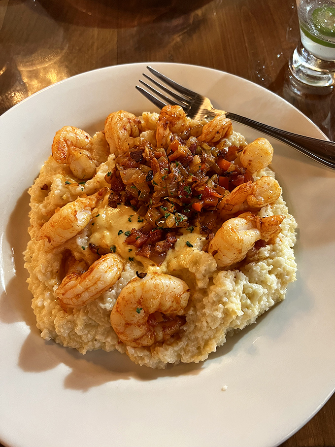 Shrimp and grits elevated to an art form&mdash;plump crustaceans lounging on creamy cornmeal like they're at a five-star resort.