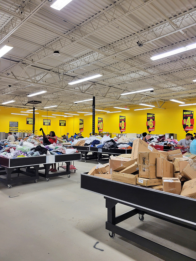 The warehouse's vastness creates a treasure map of possibilities, with yellow walls guiding shoppers through departments of potential finds.