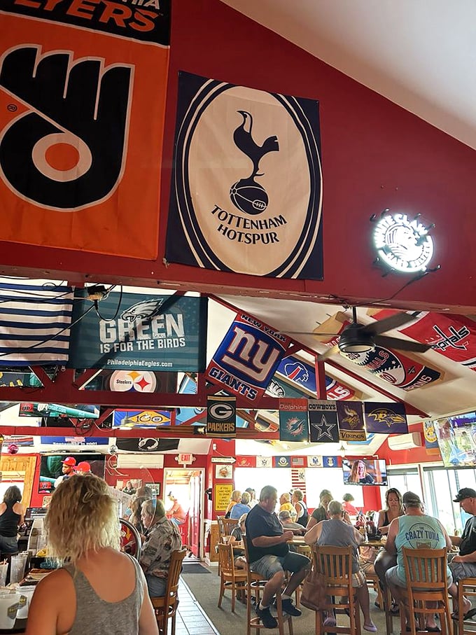 A ceiling draped with team banners like the world's most spirited library. When Maryland meets sports fanaticism, everyone wins.