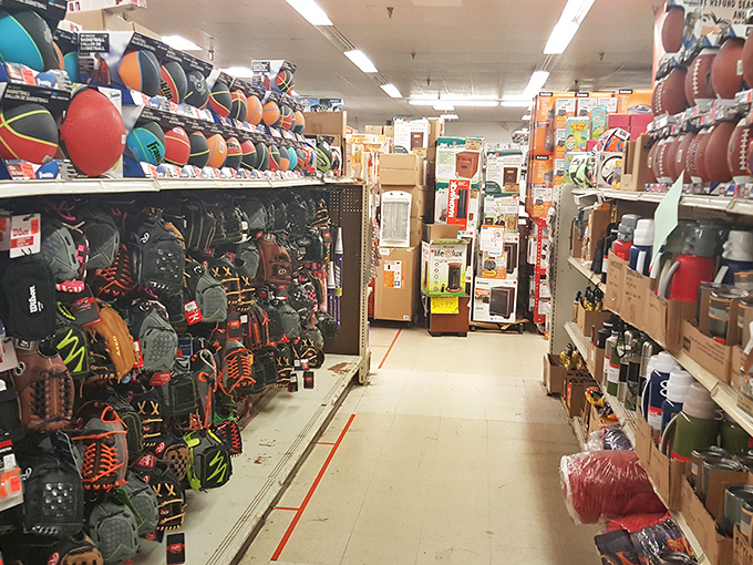 A sports equipment aisle that would make any coach proud. From footballs to fishing gear, all priced like they're coming off the bench.