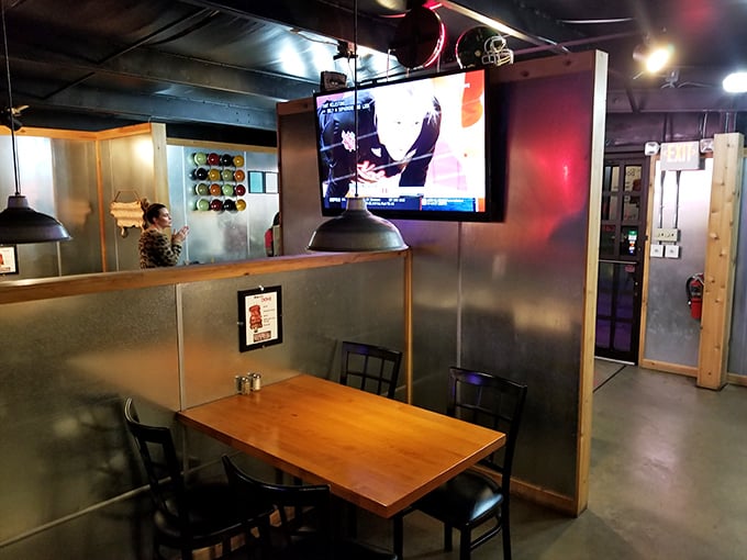Modern industrial meets rustic charm in Taylor's dining area, where the metal walls reflect both light and satisfied smiles.