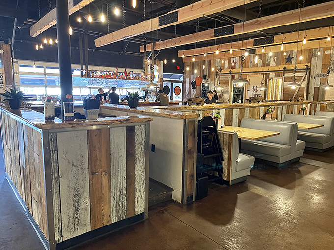 The open kitchen design isn't just trendy&mdash;it's a stage where culinary magic happens. Those wooden accents practically whisper "authentic barbecue ahead."