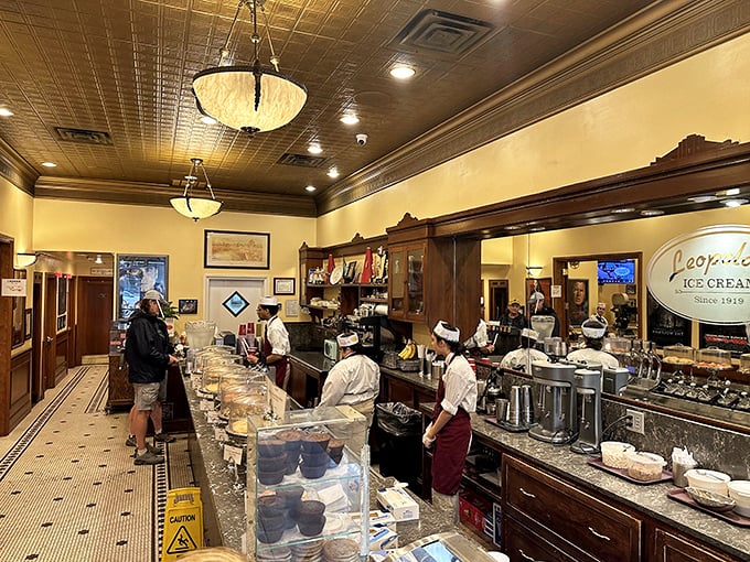 The soda fountain squad works with balletic precision. Their white hats aren't just nostalgic&mdash;they're crowns for ice cream royalty.