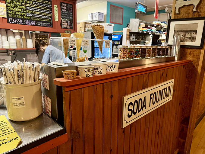 "We make old fashion ice cream" isn't just a sign—it's a promise delivered in every scoop that passes over that wooden counter.