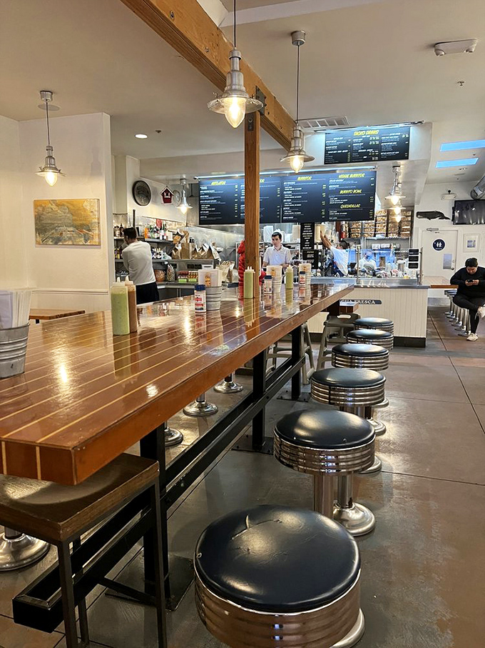 The open kitchen design lets you witness the burrito magic happening in real time&mdash;like watching artists at work, but with more guacamole.