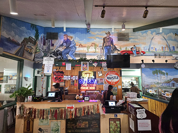 The heart of the operation &ndash; where orders fly in and breakfast treasures emerge under the watchful gaze of Route 66 memorabilia.