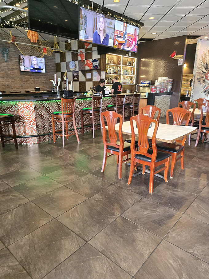 Where the magic happens &ndash; the bar area combines colorful tiles, brick walls, and the promise of seafood treasures to come.
