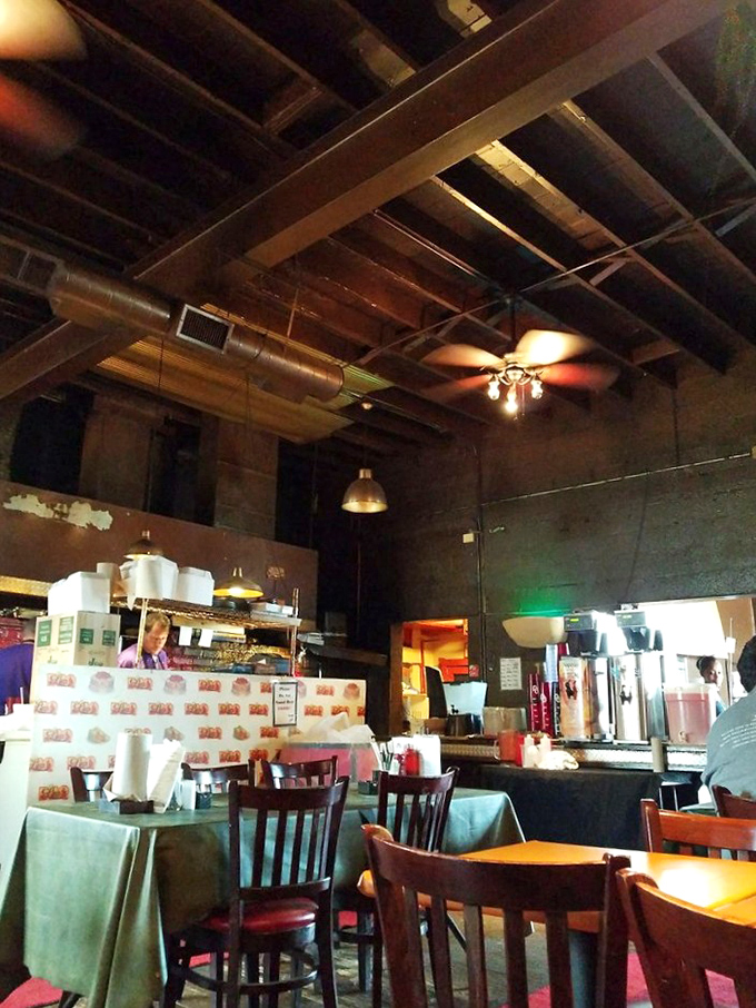 High ceilings and simple d&eacute;cor keep the focus where it belongs &ndash; on the smoky treasures being prepared behind that counter.